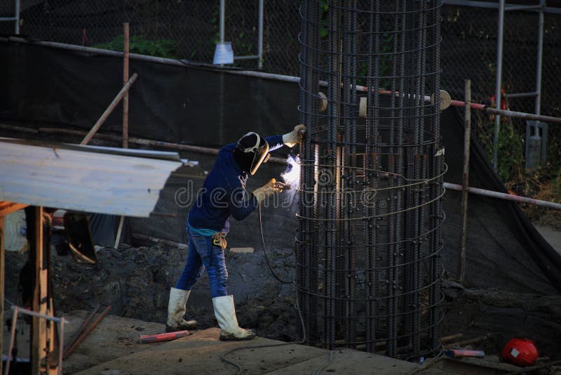Construction Worker and Working in the Construction Area of Tall ...