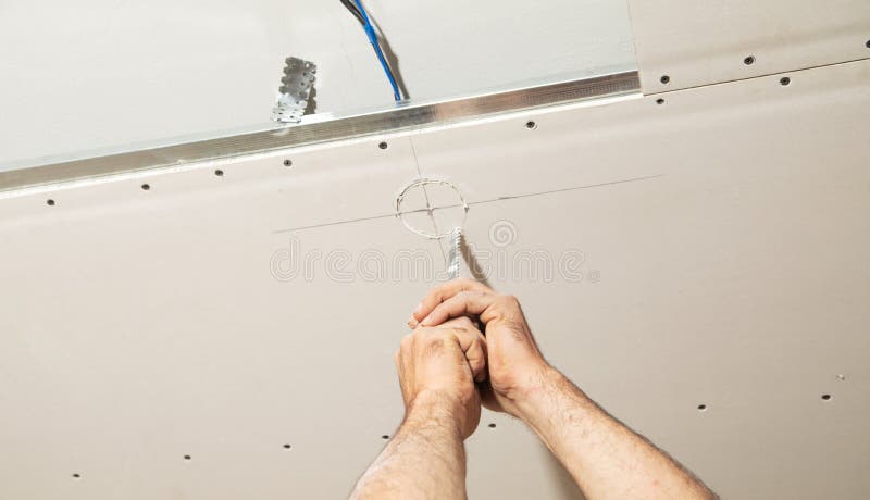 Construction Worker Working on Ceiling at Home Stock Photo - Image of ...