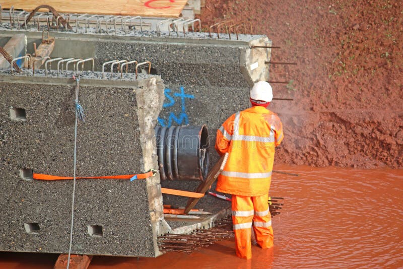 Construction Worker with a Bridge Beam Stock Photo - Image of earth ...