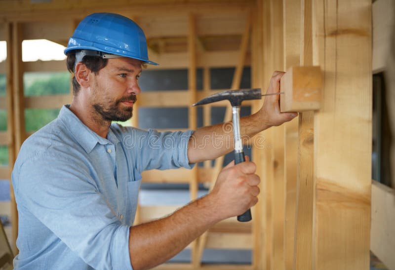 Construction Worker Working with Hammer on Wooden Frame, Diy Eco ...