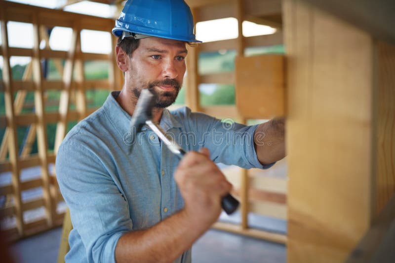 Construction Worker Working with Hammer on Wooden Frame, Diy Eco ...