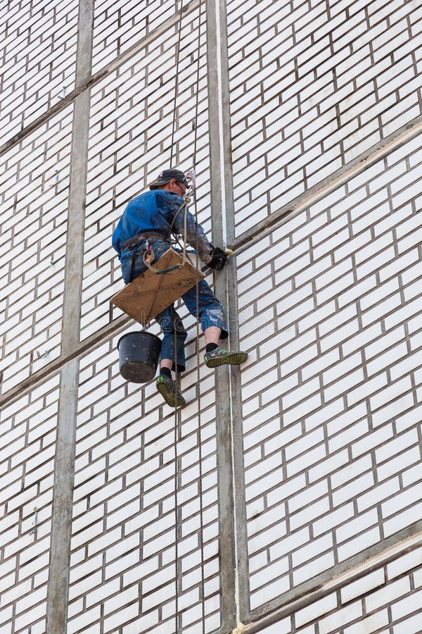 Construction Worker Working on Side of House Editorial Image - Image of ...
