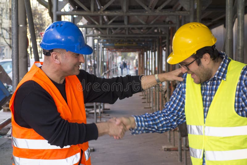 Handshaking at Construction Site Stock Photo - Image of foreman ...