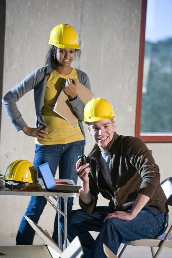Male Construction Worker with Female Colleague Stock Photo - Image of ...