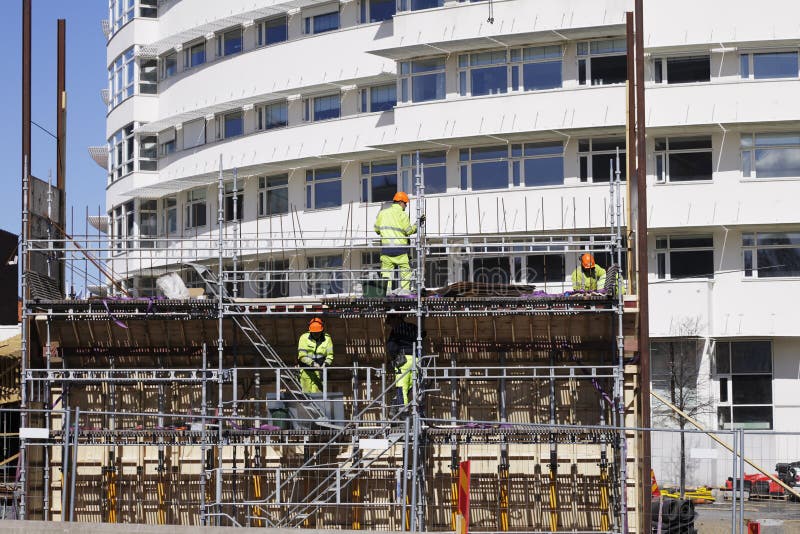 Construction Workers in Action Stock Image - Image of hardhat, exterior ...