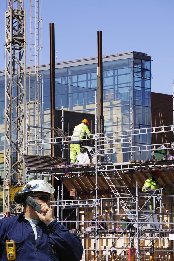 Construction Workers in Action Stock Image - Image of excavating, works ...