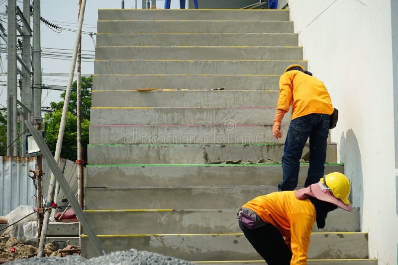 Construction Workers are Adjusting Stock Photo - Image of clothing, construction: 260497582