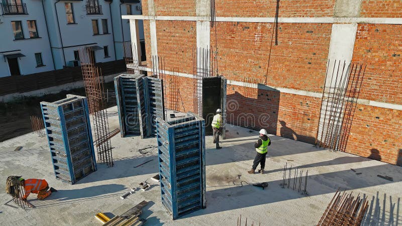 Construction Workers Assembling Concrete Formwork on Site. Stock Image ...