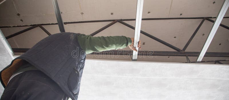 Construction Workers Assembling a Suspended Ceiling Stock Photo - Image ...