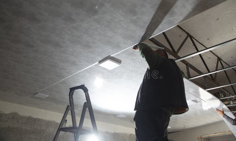 Construction Workers Assembling a Suspended Ceiling Stock Image - Image ...