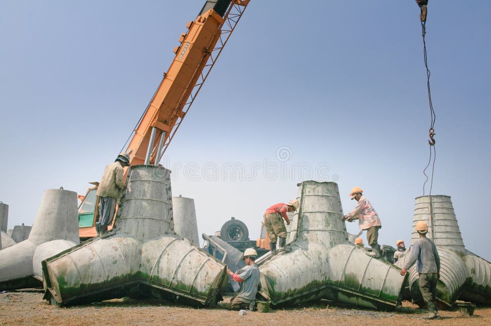 Construction Workers Assembling Wave Breaker Structures at Glagah Beach ...