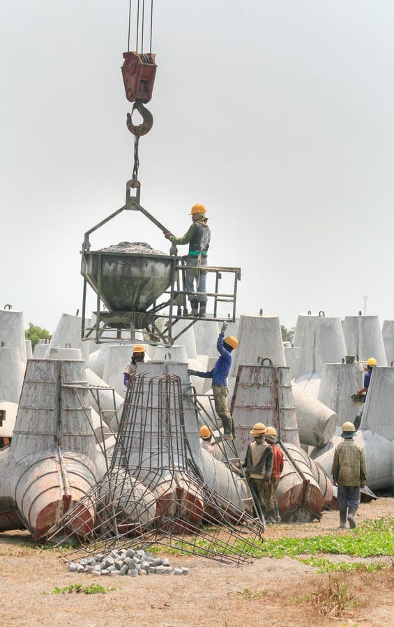 Construction Workers Assembling Wave Breaker Structures at Glagah Beach ...