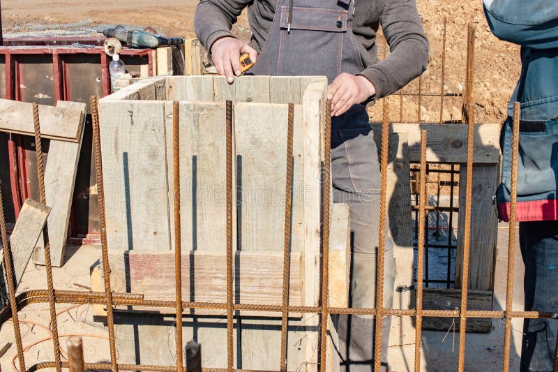 Construction Workers Assembling a Wooden Formwork for a Concrete ...