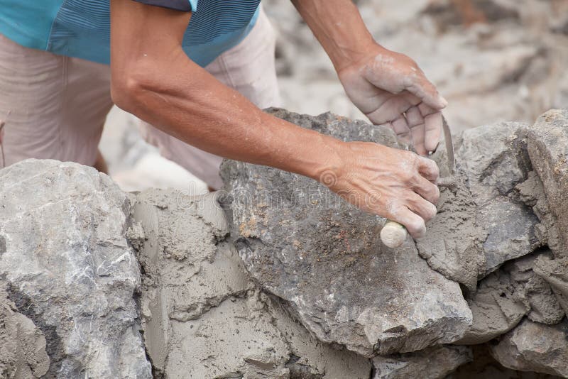 Construction Workers Build a Stone Wall Stock Photo - Image of ...