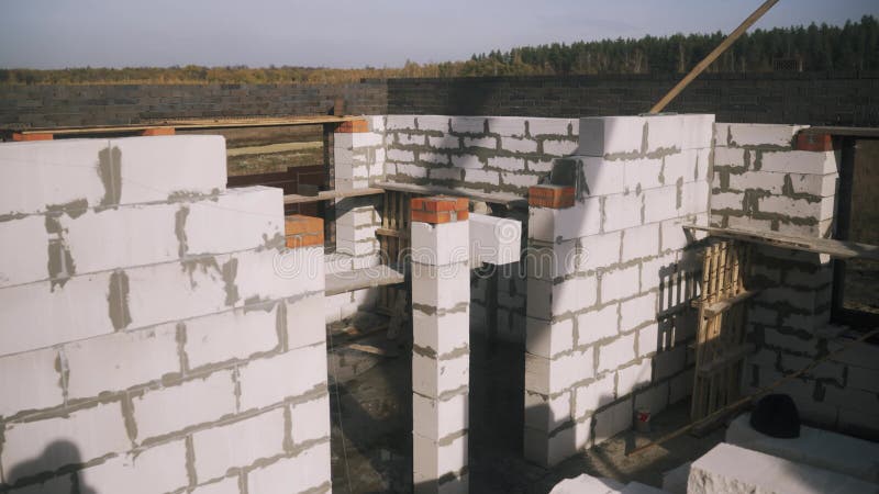Construction Workers Building Walls with White Bricks. Stock Footage ...