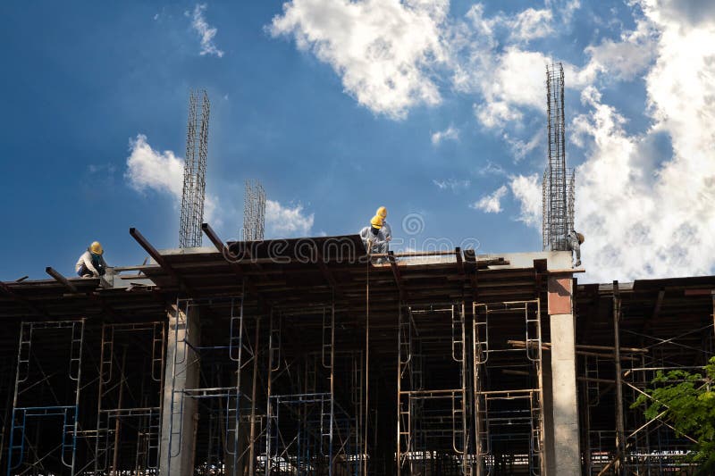 Construction Workers or Builder Workers Working on Contruction Site ...