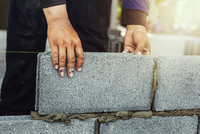 Construction Workers are Building Cement Walls with Brick Blocks Stock ...