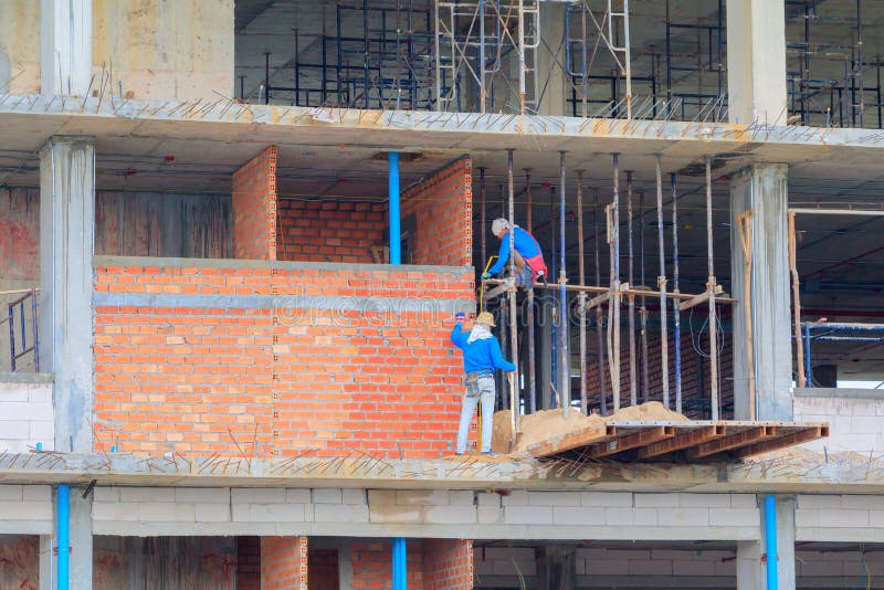 Construction Workers Building Develop of Housing at Laborer Work ...