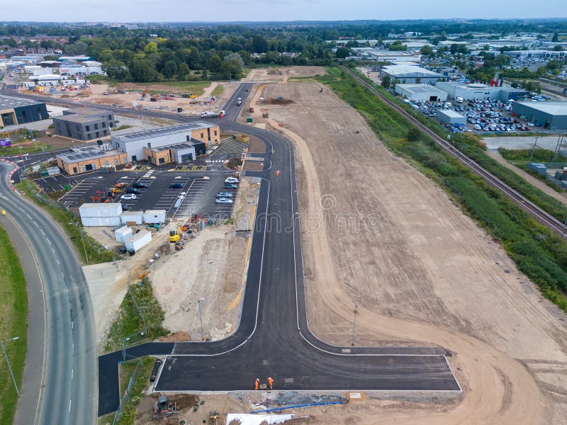 Construction Workers Building New Road in Industrial Estate Development ...