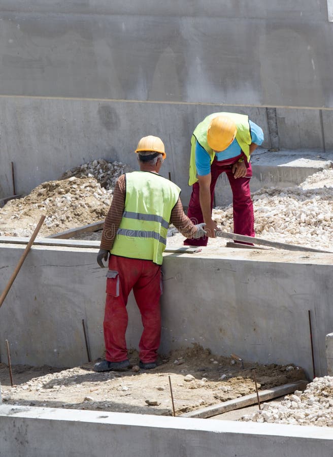 Construction Workers at Building Site Editorial Photo - Image of ...