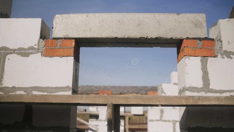 Construction Workers Engaged in Installing a Concrete Lintel for a ...