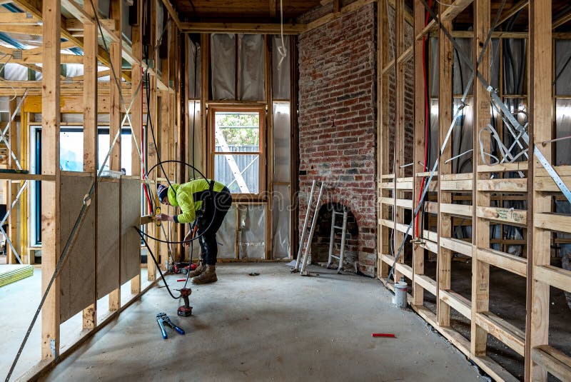 Construction Workers Captured in a House Undergoing Internal Renovation ...