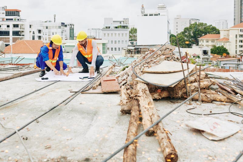 Construction Workers Checking Blueprint Stock Image - Image of ...