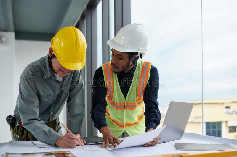 Construction Workers Checking Building Blueprints Stock Photo - Image ...