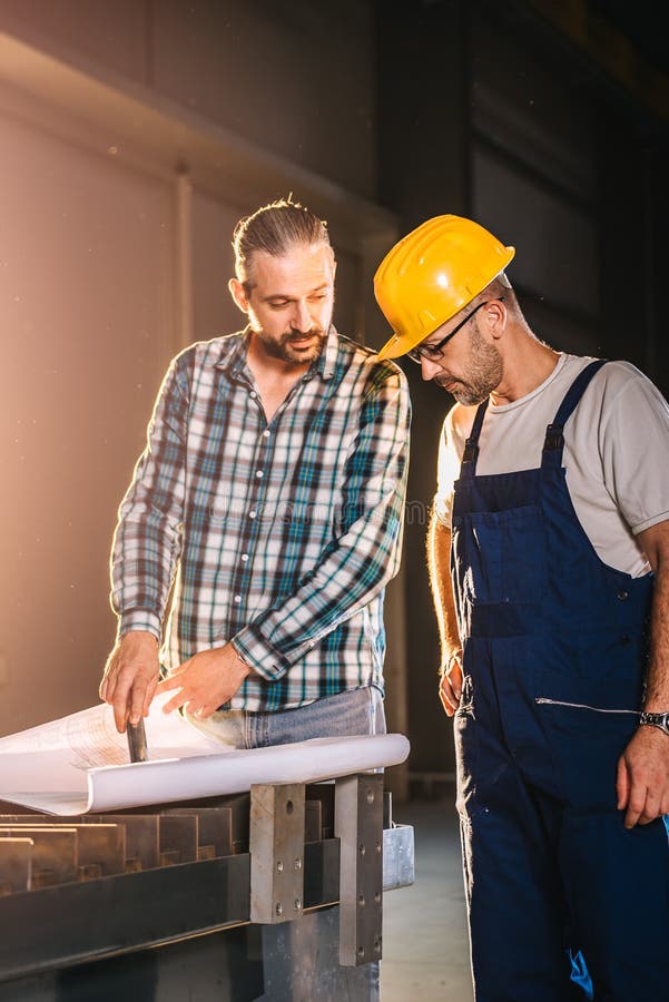 Construction Workers Checking Checking Blue Print Stock Photo - Image ...