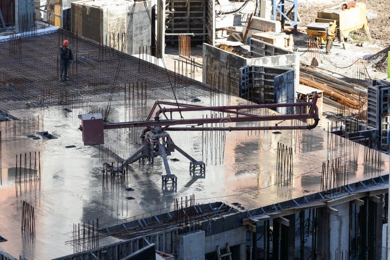 Construction Workers Collaborating in the Installation of Cement ...