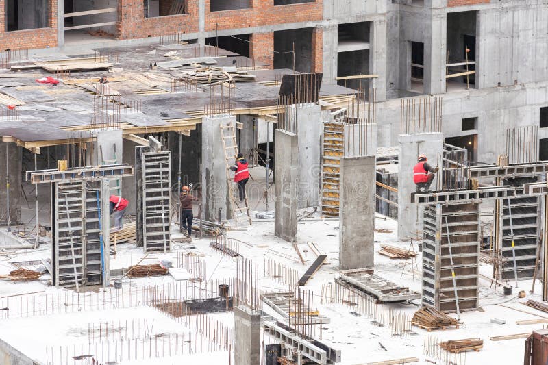 Construction Workers Collaborating in the Installation of Cement ...