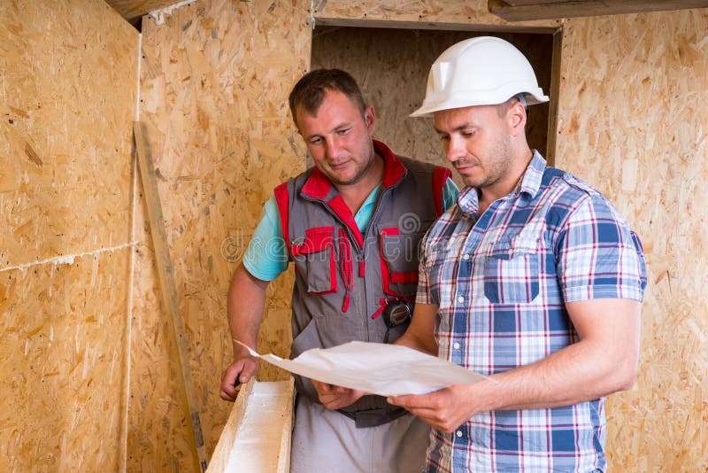 Foreman Inspecting Work on Staircase in New Home Stock Photo - Image of ...