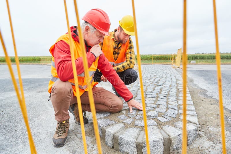 Construction Workers Control the Construction of the Roadway Stock ...