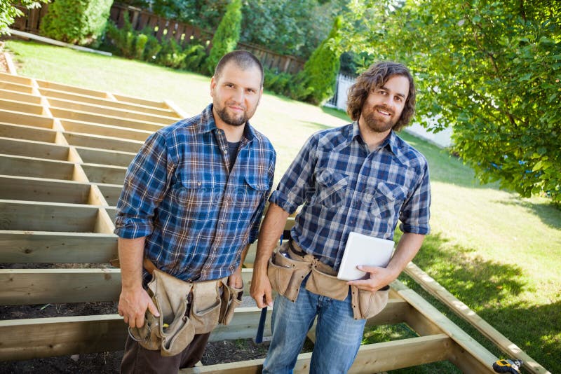 Construction Workers with Digital Tablet at Stock Photo - Image of ...