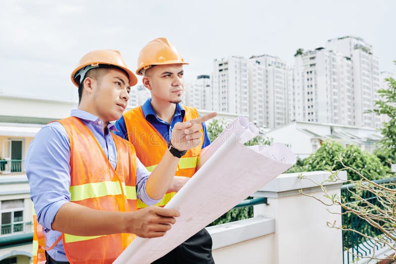 Construction Workers Discussing Project Stock Image - Image of engineer ...
