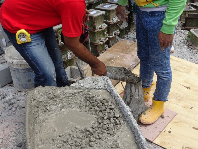 Construction Workers Doing Slump Test Using Appropriate Equipment at ...