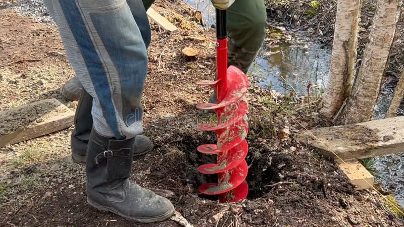 Construction Workers Drill the Ground with Hand Held Gasoline Powered ...
