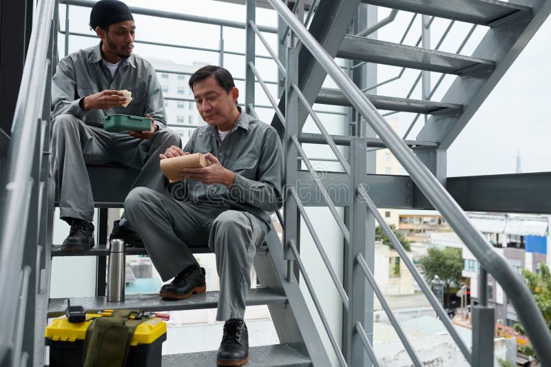 Construction Workers Eating Lunch Stock Photo - Image of industry, work ...