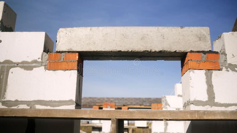 Construction Workers Engaged in Installing a Concrete Lintel for a ...