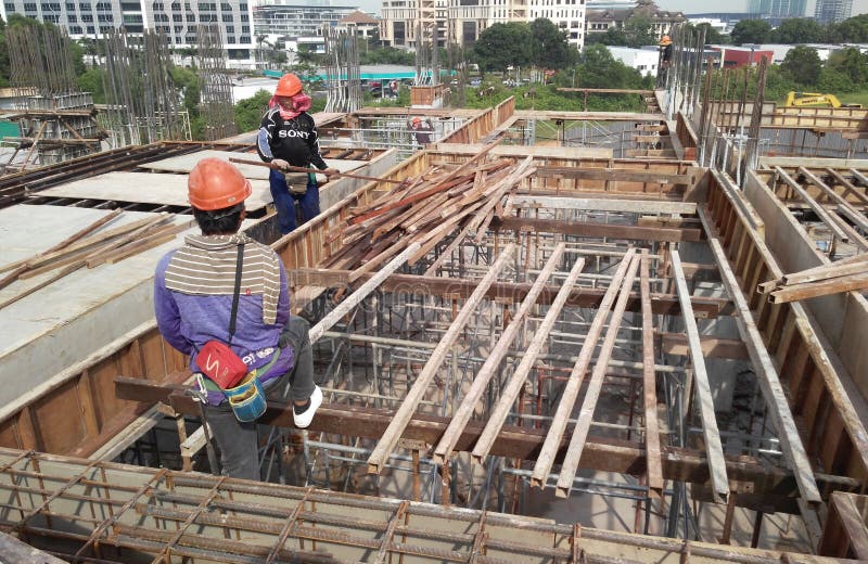Construction Workers Fabricated Timber Form Work at the Construction ...