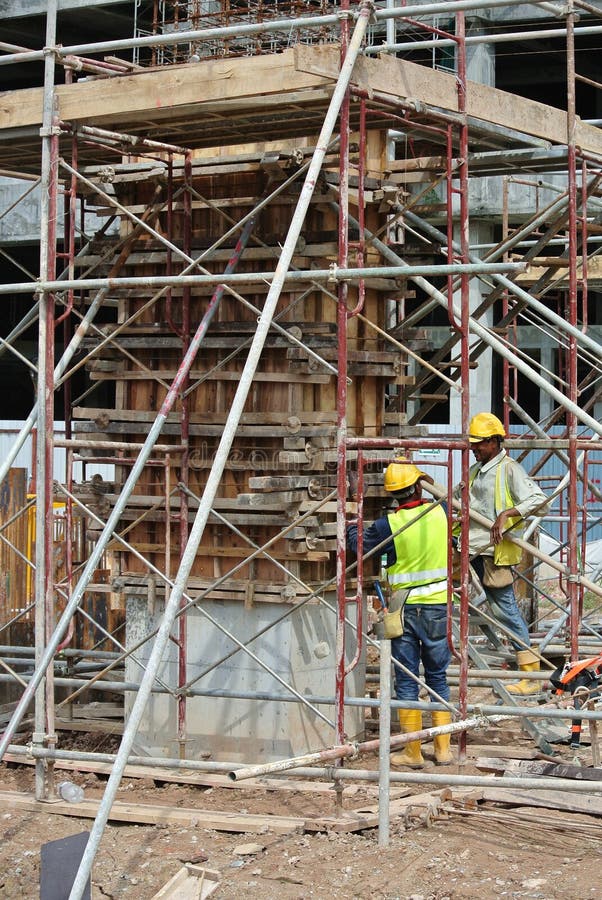 Construction Workers Fabricating Timber Column Formwork at the ...