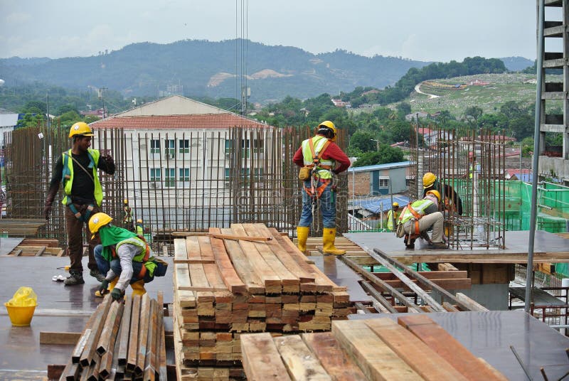 Construction Workers Fabricating Timber Form Work at the Construction ...