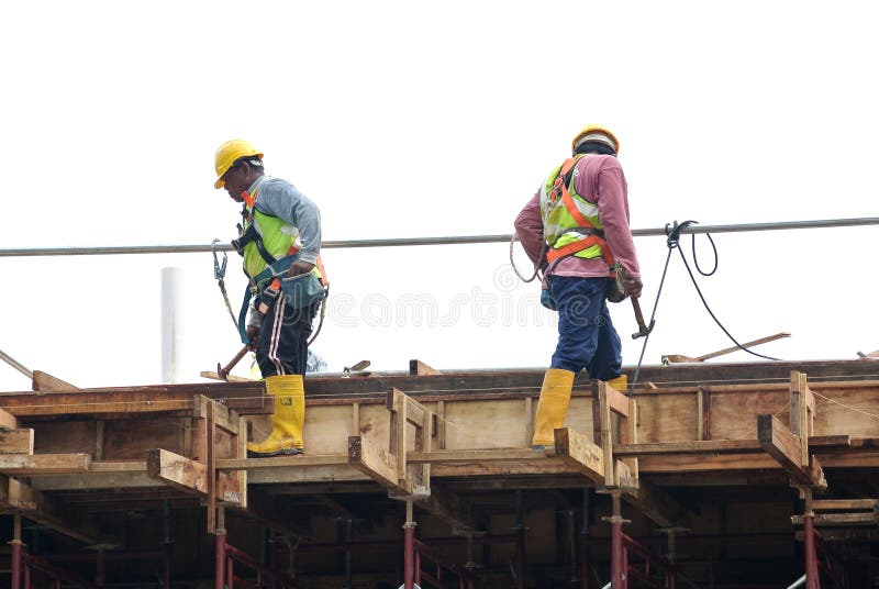 Construction Workers Fabricating Timber Form Work at the Construction ...