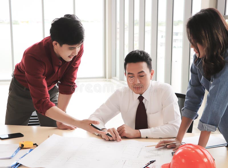 Construction Workers , a Female Architech and Two Male Engineers ...