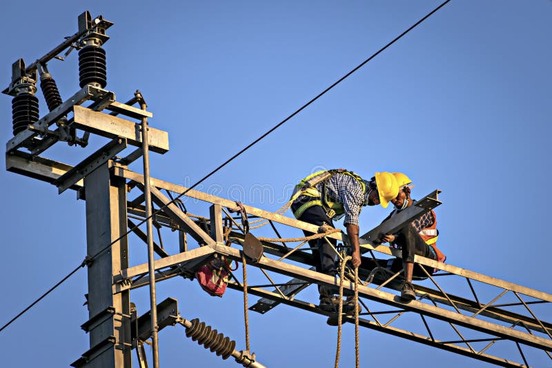 Construction Workers Fixing Overhead Electrical Cables of Pune Metro ...