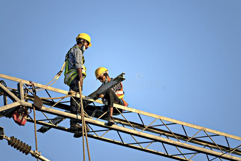 Construction Workers Fixing Overhead Electrical Cables of Pune Metro ...