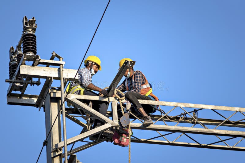 Construction Workers Fixing Overhead Electrical Cables of Pune Metro ...
