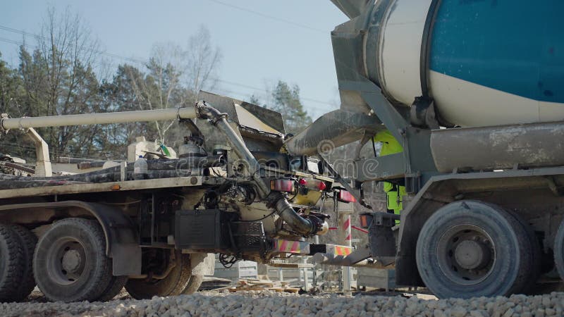 Construction Workers Guiding Concrete Mixer Truck, Transferring Cement ...