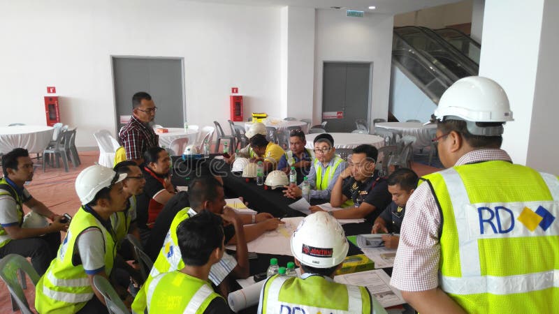 Construction Workers Having a Discussion at the Construction Site ...