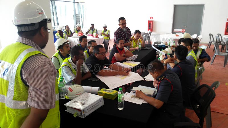 Construction Workers Having a Discussion at the Construction Site ...